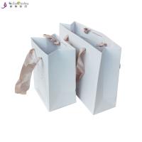 China Biodegradable Ribbon Handle Shopping Bags Custom Printed Paper  Glossy Lamination for sale