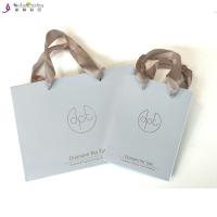China Biodegradable Ribbon Handle Shopping Bags Custom Printed Paper  Glossy Lamination for sale