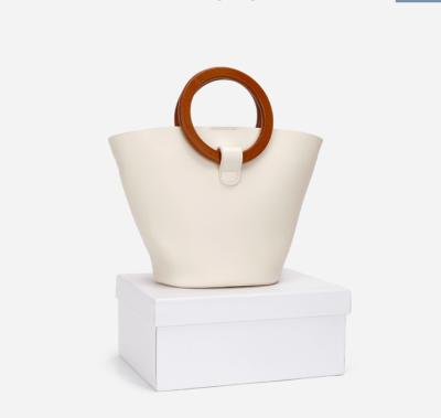 China 20cm Women's Leather Bucket Bag with Wooden Ring Handle Portable Handbag for sale