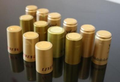 China Customize PVC Heat Shrink Caps Seal For Wine Liquor Bottle Cap Shrink Wrap With Tear stripe for sale