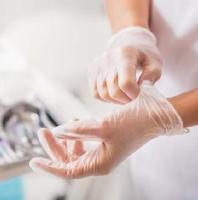 China Clear Disposable Vinyl Exam Gloves With Rolled Rim Power Free Wear Resistant for sale