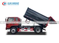 China FAW Jiefang Tiger VH 4x2 Side-Loading Garbage Truck with Offset Hopper and Bucket Lift for Narrow Street Access and Hydraulic Compaction for sale