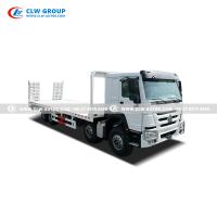 China Sinotruk HOWO 8x4 400HP Flatbed Truck with 9m Manganese Steel Deck and Hydraulic Ramp for Heavy Machinery Transport for sale
