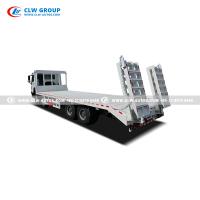 China Sinotruk HOWO 8x4 400HP Flatbed Truck with 9m Manganese Steel Deck and Hydraulic Ramp for Heavy Machinery Transport for sale