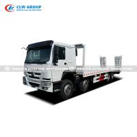 China Sinotruk HOWO 8x4 400HP Flatbed Truck with 9m Manganese Steel Deck and Hydraulic Ramp for Heavy Machinery Transport for sale