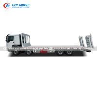 China Sinotruk HOWO 8x4 400HP Flatbed Truck with 9m Manganese Steel Deck and Hydraulic Ramp for Heavy Machinery Transport for sale