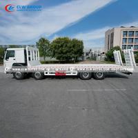 China Sinotruk HOWO 8x4 400HP Flatbed Truck with 9m Manganese Steel Deck and Hydraulic Ramp for Heavy Machinery Transport for sale