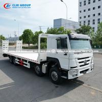 China Sinotruk HOWO 8x4 400HP Flatbed Truck with 9m Manganese Steel Deck and Hydraulic Ramp for Heavy Machinery Transport for sale