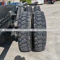 China Sinotruk HOWO 8x4 400HP Flatbed Truck with 9m Manganese Steel Deck and Hydraulic Ramp for Heavy Machinery Transport for sale