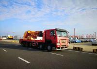 China 100 Ton Heavy Duty Truck Mounted Telescopic Crane with 15m Reach and 16.8m Height on 10x4 SINOTRUK HOWO Chassis for sale