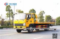 China FAW 4x2 Left Hand Drive Flatbed Towing Truck 120HP 5000kg Capacity for sale