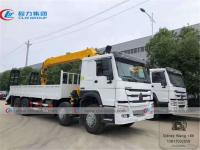 China 8x4 HOWO Flatbed Truck Mounted Telescoping Boom Crane 16T Capacity with 272kW Engine for sale