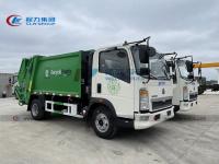 China 140HP 6m3 Howo RHD Rear Load Garbage Truck Waste Collector Truck 6000Liters for sale