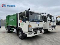 China 140HP 6m3 Howo RHD Rear Load Garbage Truck Waste Collector Truck 6000Liters for sale