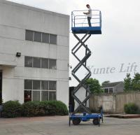 China Hydraulic Mobile Scissor Lift 6 Meters Platform Height 1 Ton Loading Capacity For Exhibition Hall for sale