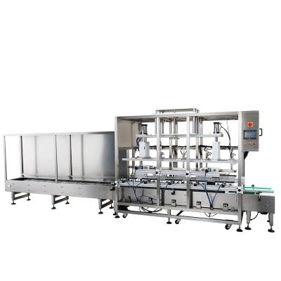 China High output 5-head weighing filling machine with Filling capacity of 10-50KG/barrel for sale