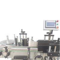 China Vertical Positioning Sticker Labeling Machine for Round Liquor/Beer/Wine Bottles for sale
