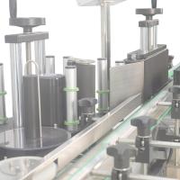 China Vertical Positioning Sticker Labeling Machine for Round Liquor/Beer/Wine Bottles for sale
