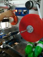 China Electric Driven Round Bottle Labeling Machine for Pet Bottles 76mm Roll Diameter for sale