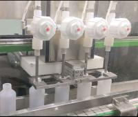 China High Speed 4 Heads Liquid Bottle Filling Capping Labeling Machine for Plastic Bottles for sale