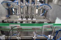 China Automatic 4 Head Hot Piston Filling Machine for Hair Gel/Wax Program Control Filling for sale
