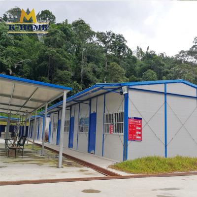 China Prefabricated House Sandwich Panel Steel Frame Prefab House for Labor Camp 3 Storey 15 Year Life for sale