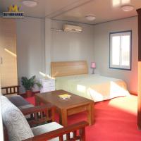 China Flat Pack Sandwich Panel Container House 54 sqm Refugee Camp Living Modular Home for sale
