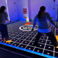 China Interactive LED Floor Game System with 6 Selectable Games, 86-inch Large Screen, and Multiplayer Team Battle Modes for sale