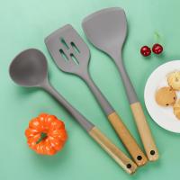 China Silicone Kitchen Three-piece Set Heat Resistant Shovel Non-stick Spoon Wooden Handle for sale