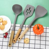 China Silicone Kitchen Three-piece Set Heat Resistant Shovel Non-stick Spoon Wooden Handle for sale