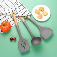 China Silicone Kitchen Three-piece Set Heat Resistant Shovel Non-stick Spoon Wooden Handle for sale