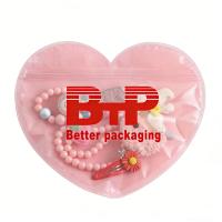China MOQ 100pcs Custom Printed Pink Heart-shaped Valentine's Day Candy Packaging Bag with Zipper Top Self-sealing Food Bag for sale