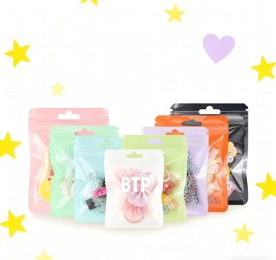China Three-seal Coloured Transparent Plastic Zip Lock Bag Sachet Jewelry & Watch Packaging Reseal Bags with Recycled Materials for sale