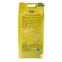 China Custom Printed Stand up Pouch Nylon Plastic 5kg 10kg Flat Bottom Rice Flour Food Packaging Bags with Handle for sale