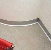 China Self Adhesive Aluminum Skirting Profile 60mm Curved Metal Coved Skirting Board for sale