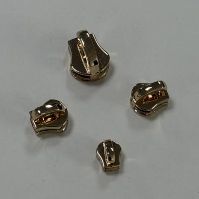 China Non Slip Easy Pulling #3 Metal Zipper Slider Light Gold Soft Comfortable Hand Feel for sale