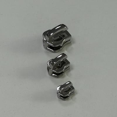 China Fine Texture #3 Metal Zipper Non Lock Pin Lock Slider 5mm Width Electroplated Finish for sale