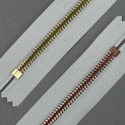 China Light Luxury Brass Zipper #5 Soft Double Pointed Teeth Metal Zipper Customizable for sale