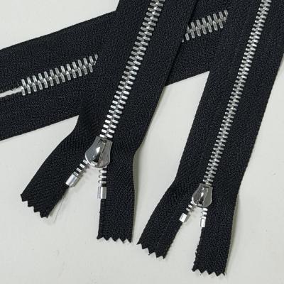 China Brass Metal Zipper #5 Corn Teeth Strong Bite Force Polished Finish for Bags for sale