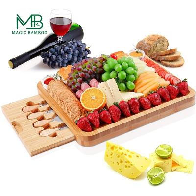 China Gift-Worthy Rectangle Bamboo Cheese Board with Full Cutlery and Ceramic Sauce Plate for sale