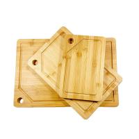 China OEM/ODM Accepted Rectangle Bamboo Three-Piece Cutting Board Set with Hanging Holes for sale