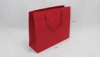 China 4C 6C Offset Printing Garment Paper Bags Dazzling Red Paper Gift Bags With Handles for sale