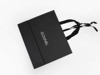 China Full Embossing Black Dyed Garment Paper Shopping Bags With Handles for sale