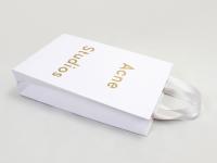 China Luxury Dyed Paper Garment Shopping Bags Letter Print Paper Bag for sale