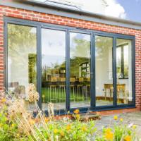 China Customizable Aluminum Folding Door with Lockable Handle Space Saving Design and High Security for sale