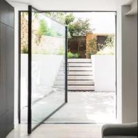 China Customizable Powder Coated Aluminum Pivot Door with Laminated Glass for Modern Entrances for sale