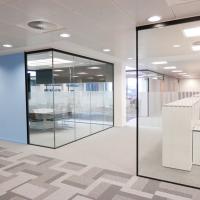 China Modern Design Frameless Glass Partition Wall with Laminated and Tempered Glass for 10 Years Warranty for sale