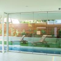 China Frameless Aluminum Bifold Door with Customizable Size and High Security for Modern Spaces for sale
