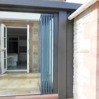 China Frameless Aluminum Bifold Door with Customizable Size and High Security for Modern Spaces for sale