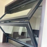 China Modern Aluminum Alloy Bi-Folding Soundproof Foldable Windows for Hotel Exterior & Balcony Vertical Folding Thermal Insulation for sale